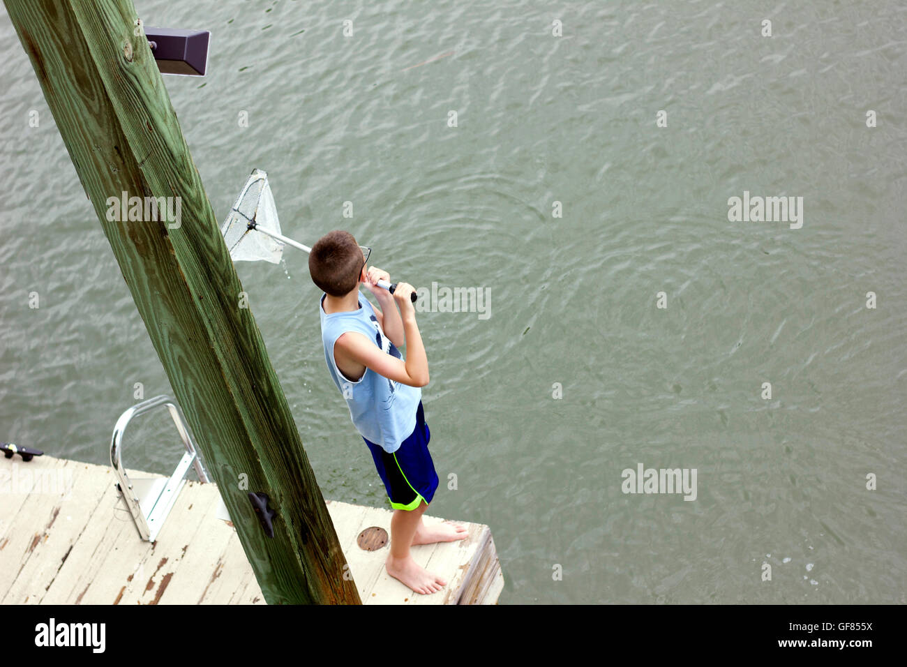 Boy fish net hi-res stock photography and images - Alamy