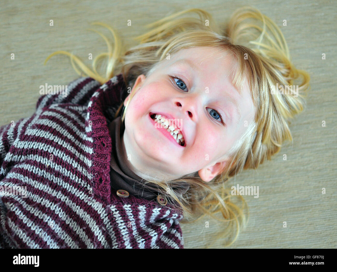 Cute baby with a long hair Stock Photo - Alamy
