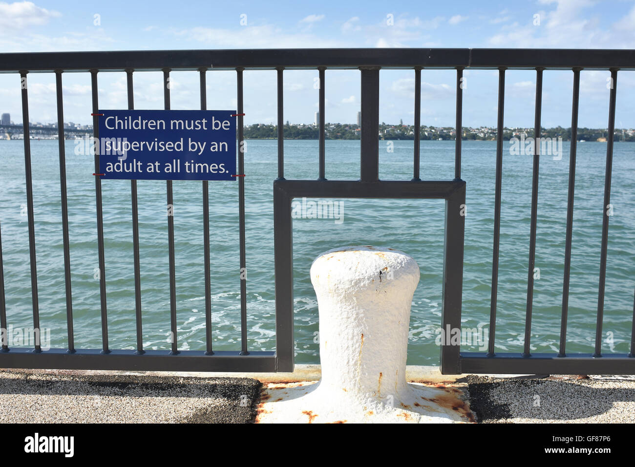 jetty metal railing warning sign Stock Photo - Alamy