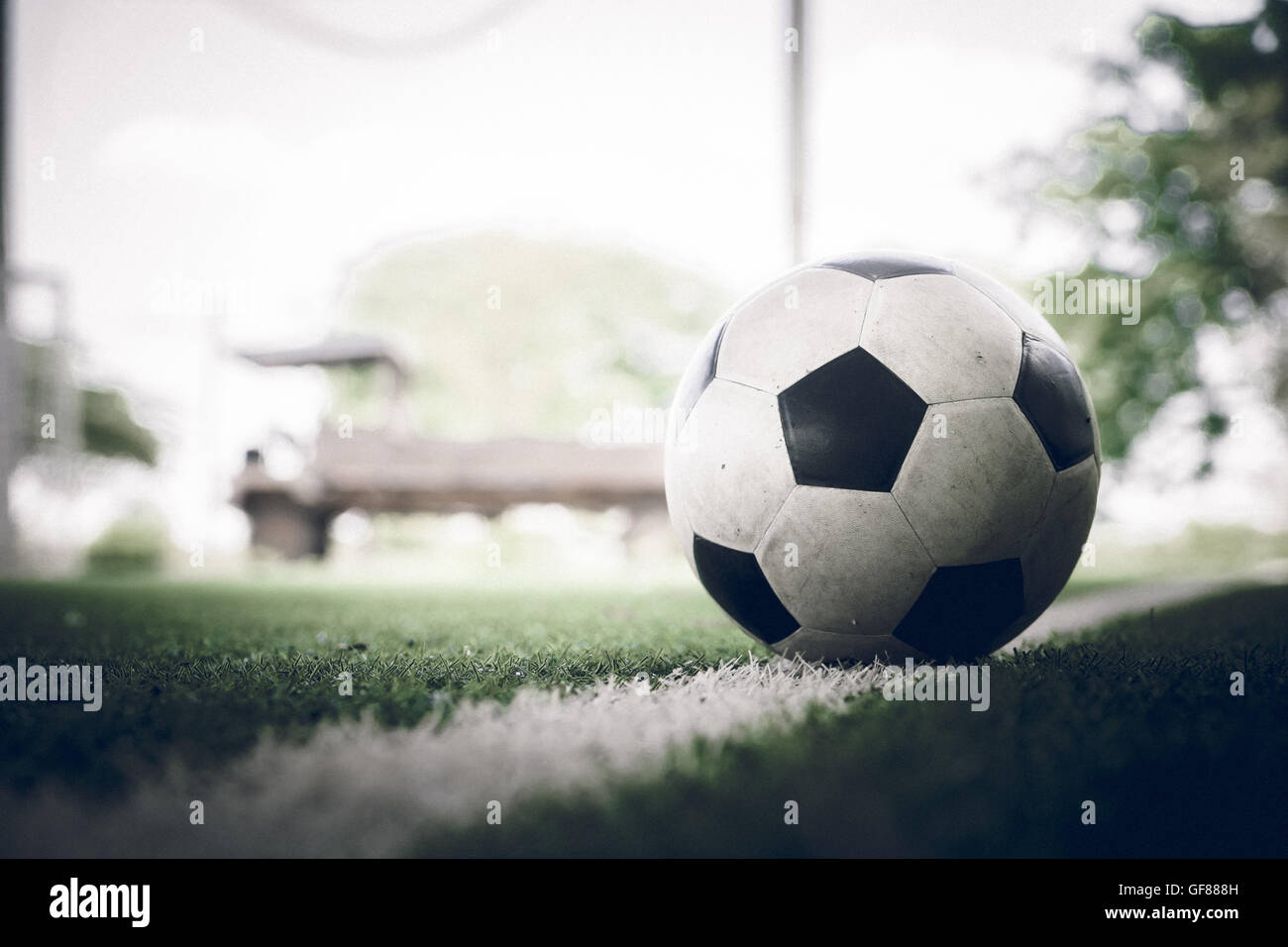 soccer ball on soccer field vintage color Stock Photo - Alamy