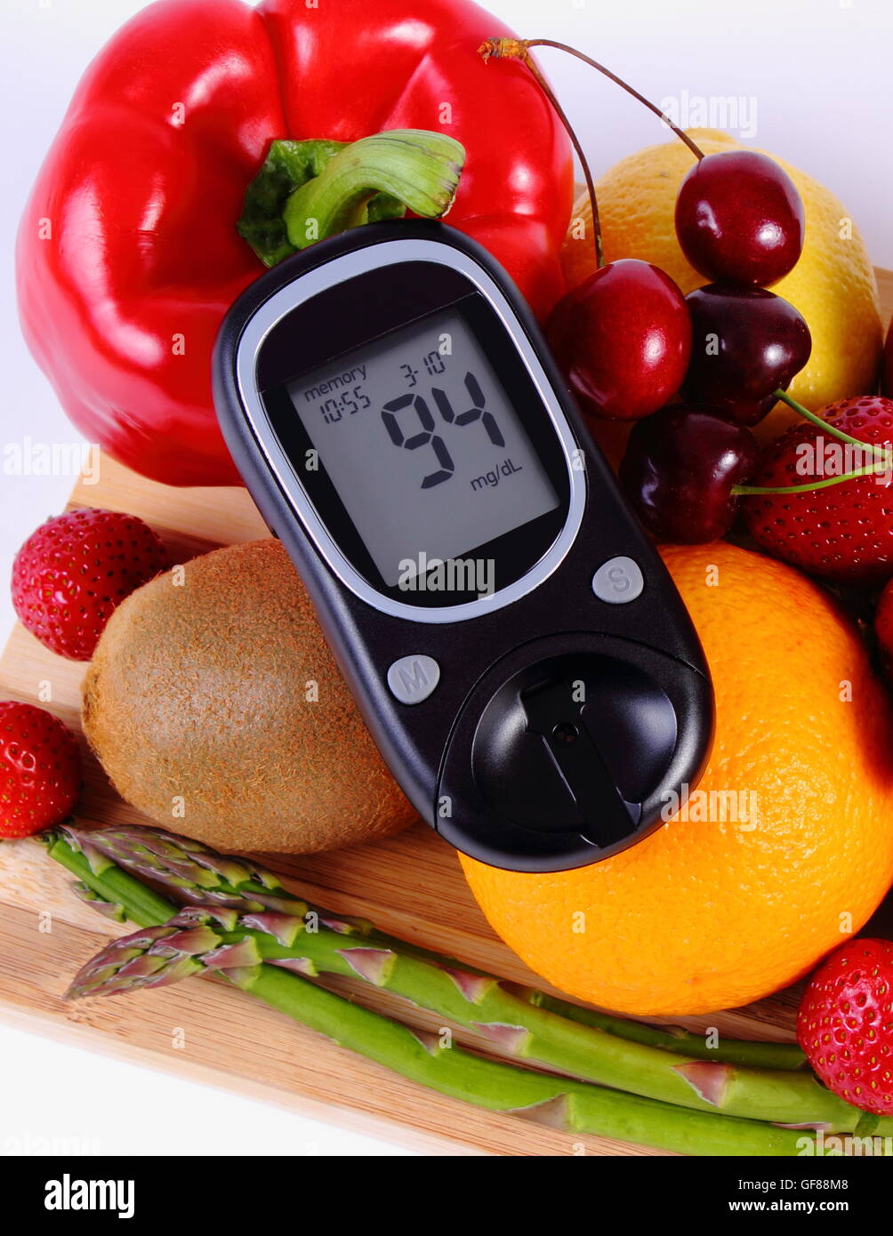 Glucose meter with fresh ripe fruits and vegetables, concept of ...