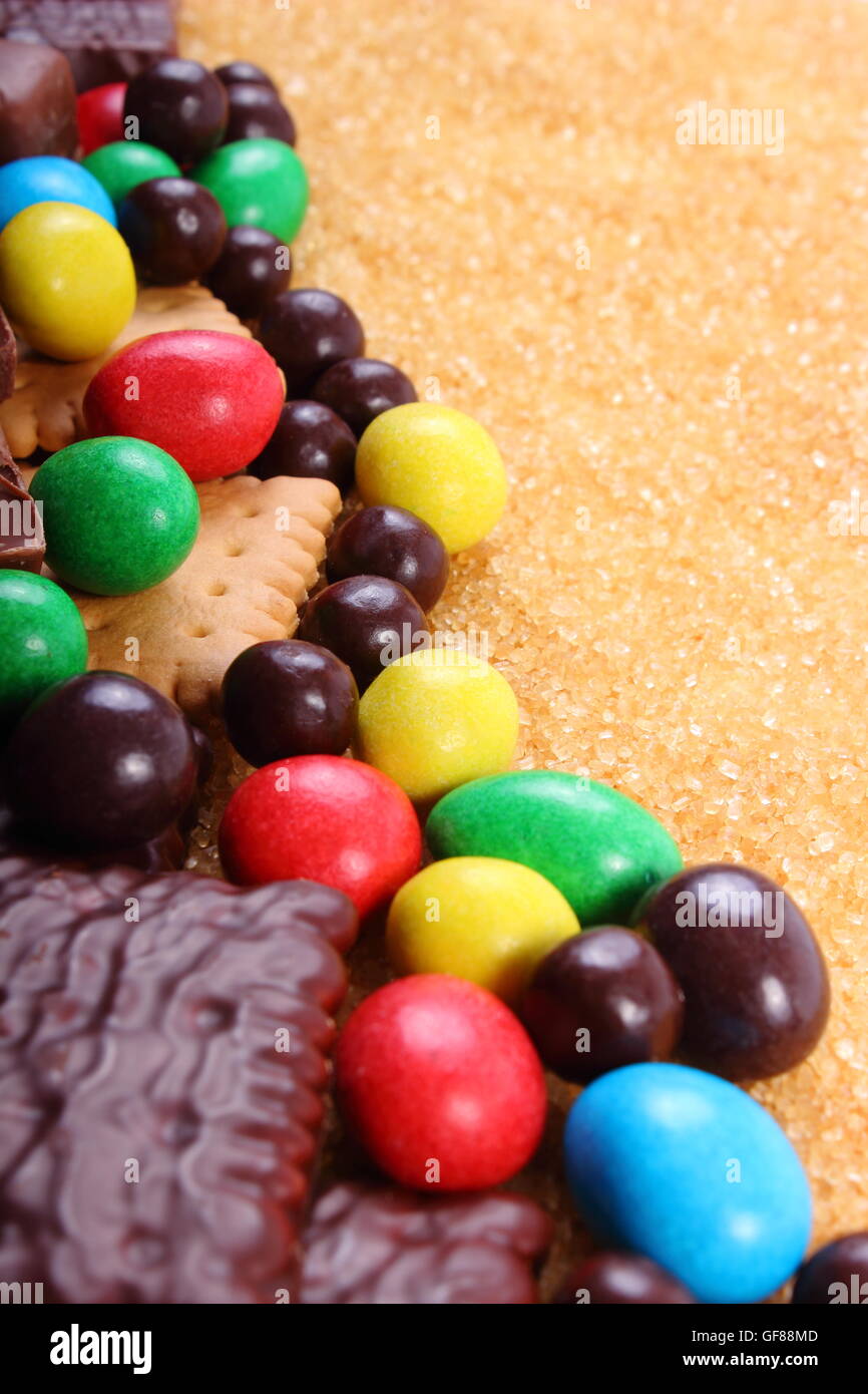 A lot of candies and cookies with brown cane sugar, too many sweets ...