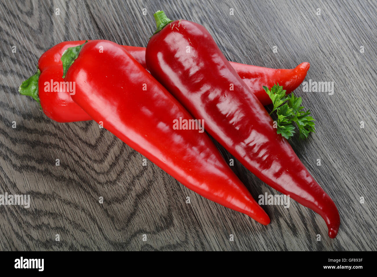Fresh ripe Ramiro pepper on wood background Stock Photo - Alamy