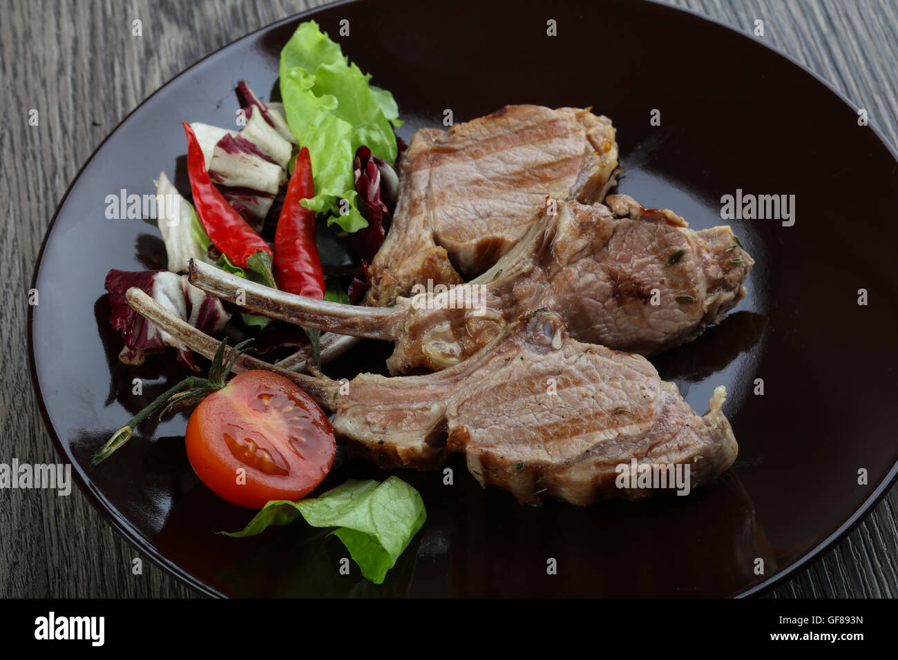 Lamb Frenched Rack grilled rib bone Stock Photo - Alamy