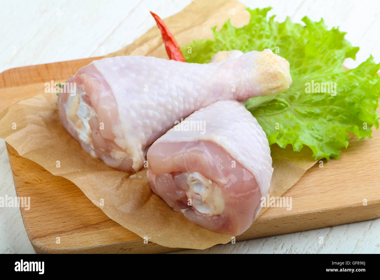 Raw chicken leg with herbs and spices ready for cooking Stock Photo - Alamy