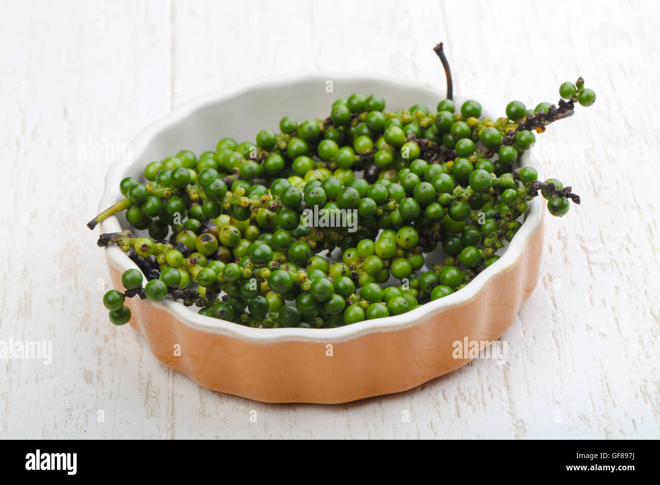 Green pepper corn on the branch in plate Stock Photo - Alamy