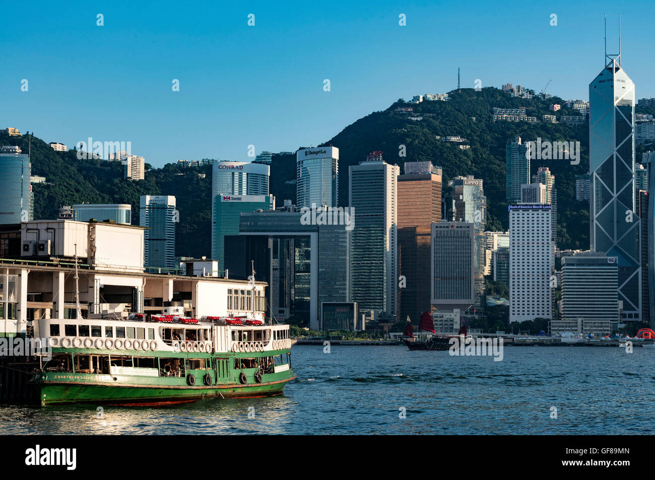 The Star ferry terminal, and central district city skyline, Victoria harbor, Hong Kong, China ...