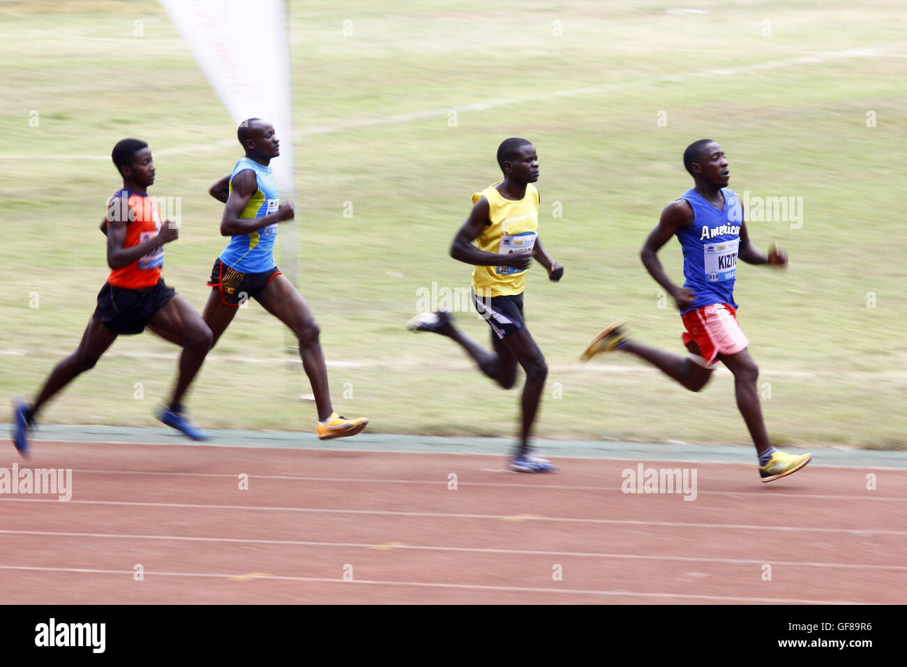 Ugandan athletes racing during the national trials at Mandela stadium ...