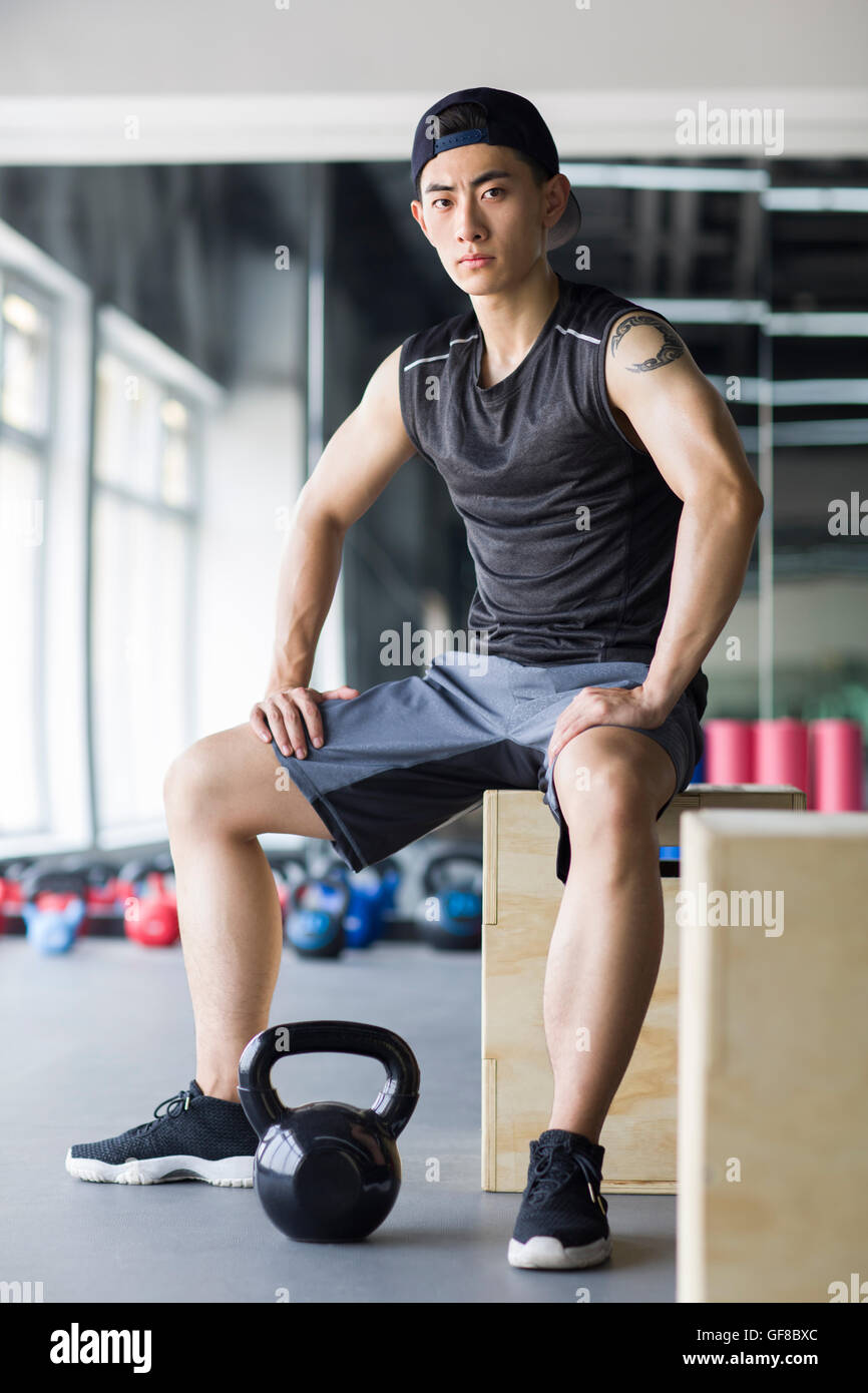 Young chinese man sitting hi-res stock photography and images - Alamy