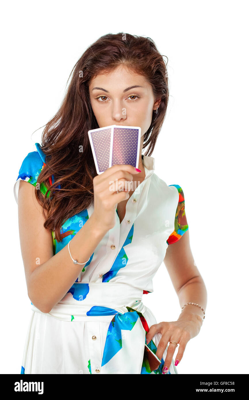Beautiful brunette holding two playing cards, isolated on white Stock ...