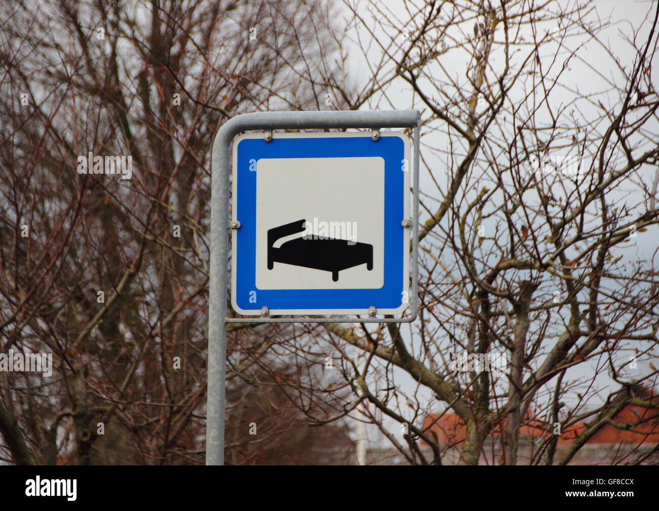Road Hotel Sleeping Metal Sign Closeup in White and Blue Stock Photo ...
