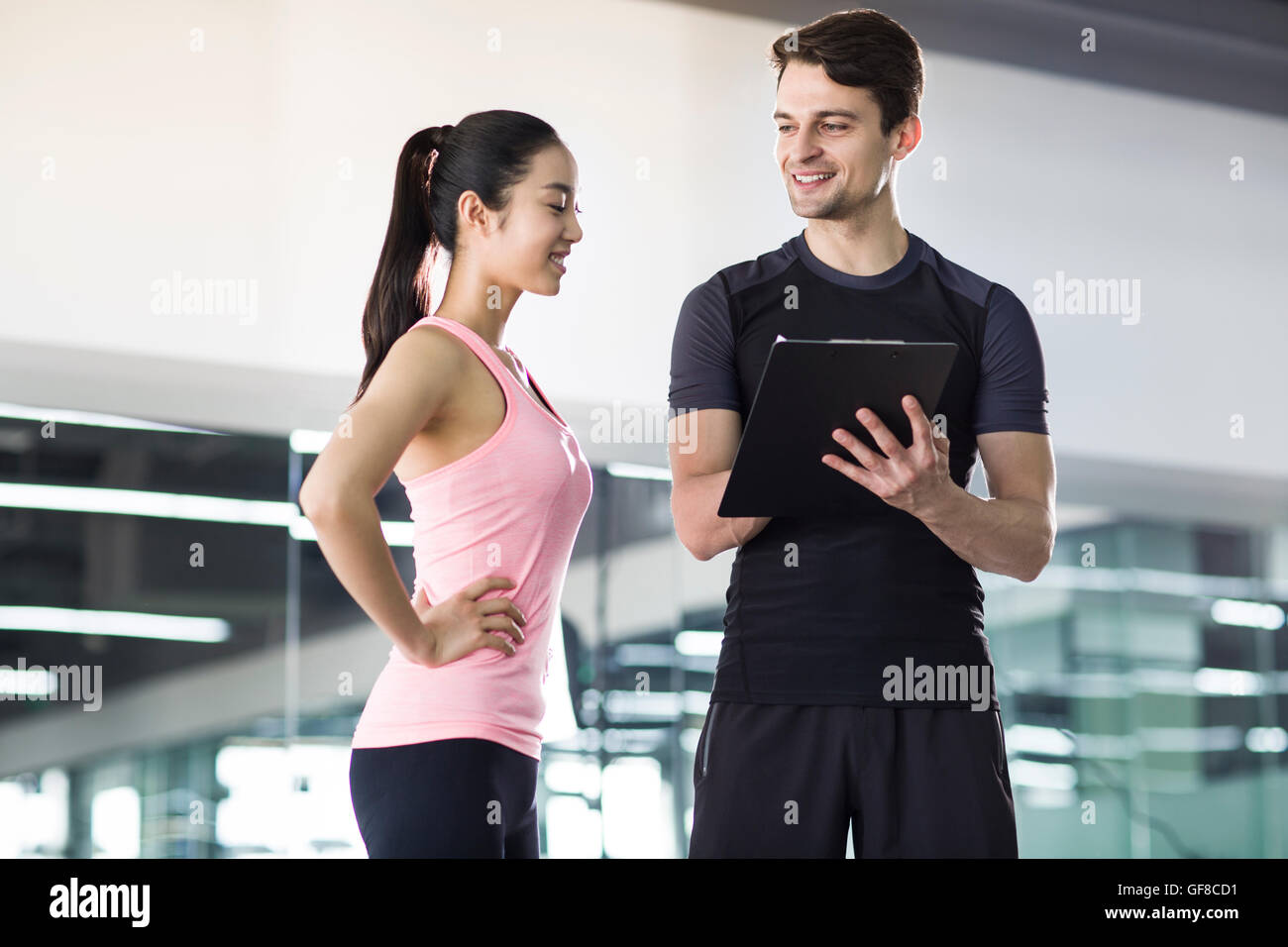 Young asian fitness instructor talking hi-res stock photography and ...