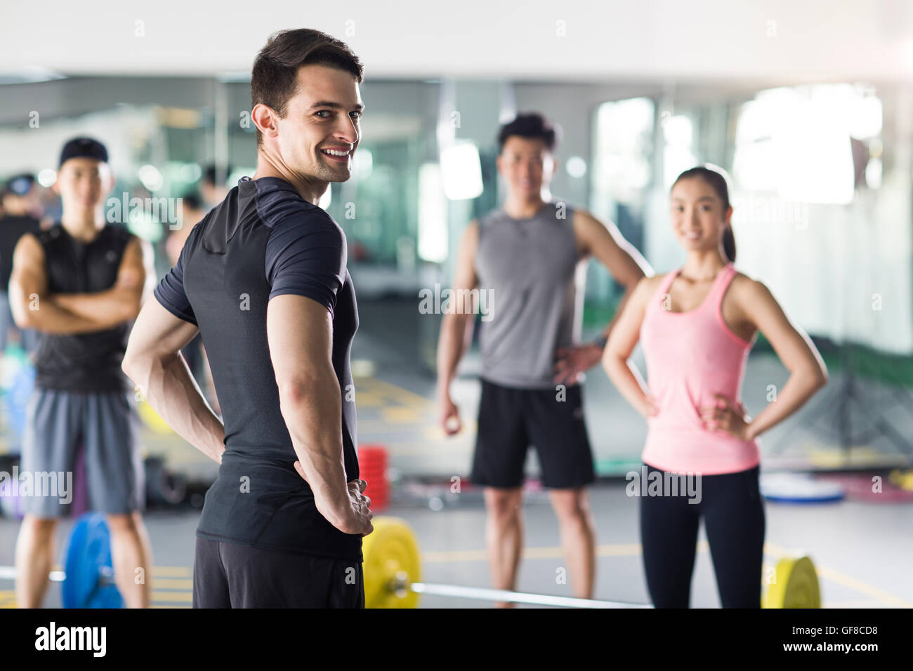 Portrait of fitness instructor at gym Stock Photo - Alamy