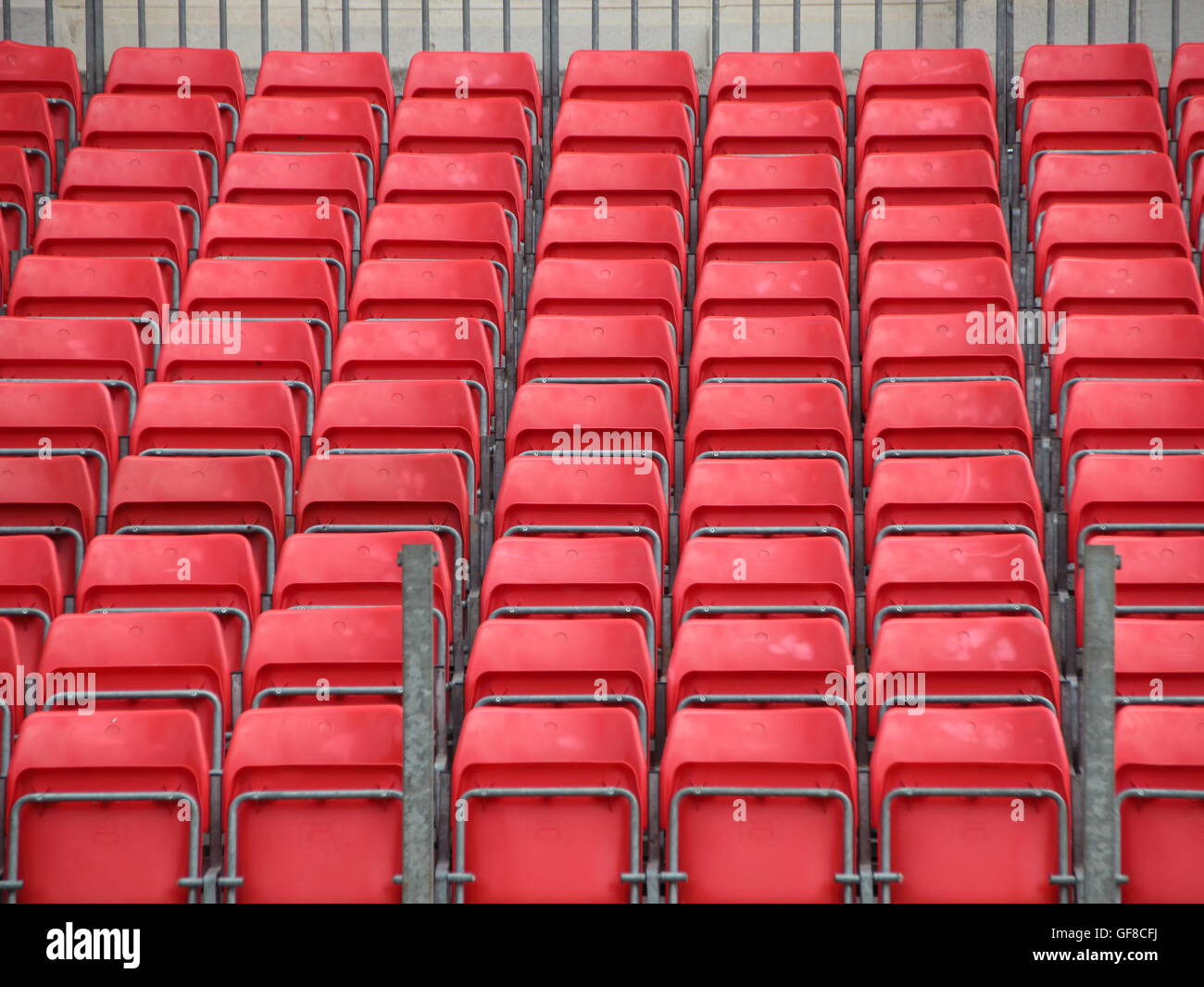 Closeup on Concert Spectator Steel Platform with Rows of Red Plastic ...