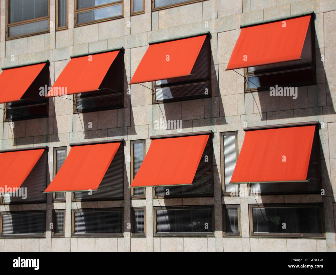 Red Overhang Sunshade Awning on Modern Building Facade Protecting from ...
