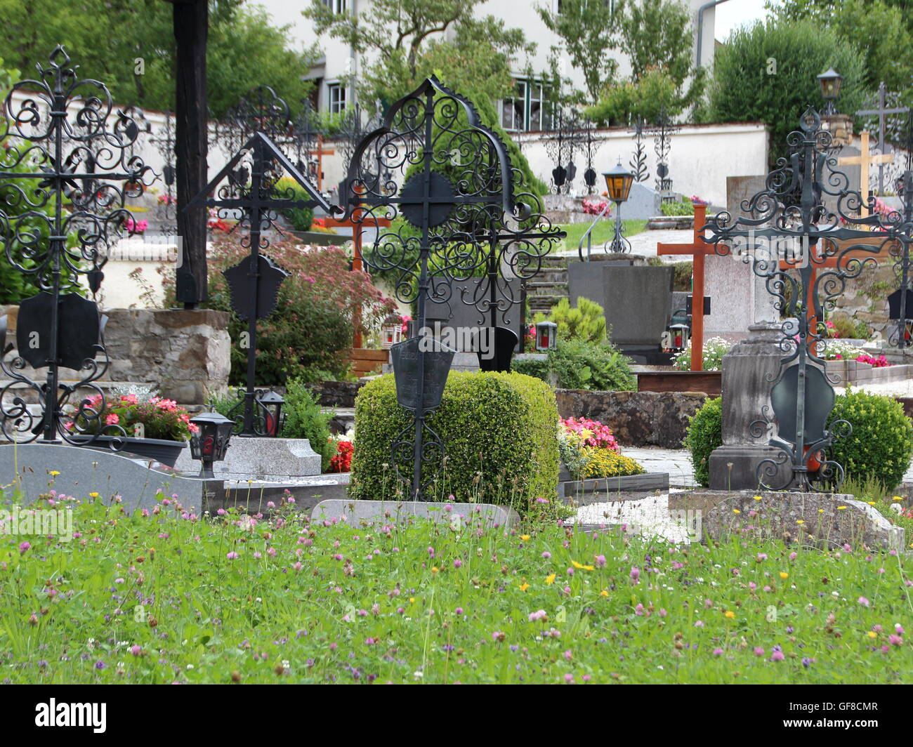 Peaceful Catholic Graveyard in Austria with Ornamented Iron Headstones Stock Photo - Alamy