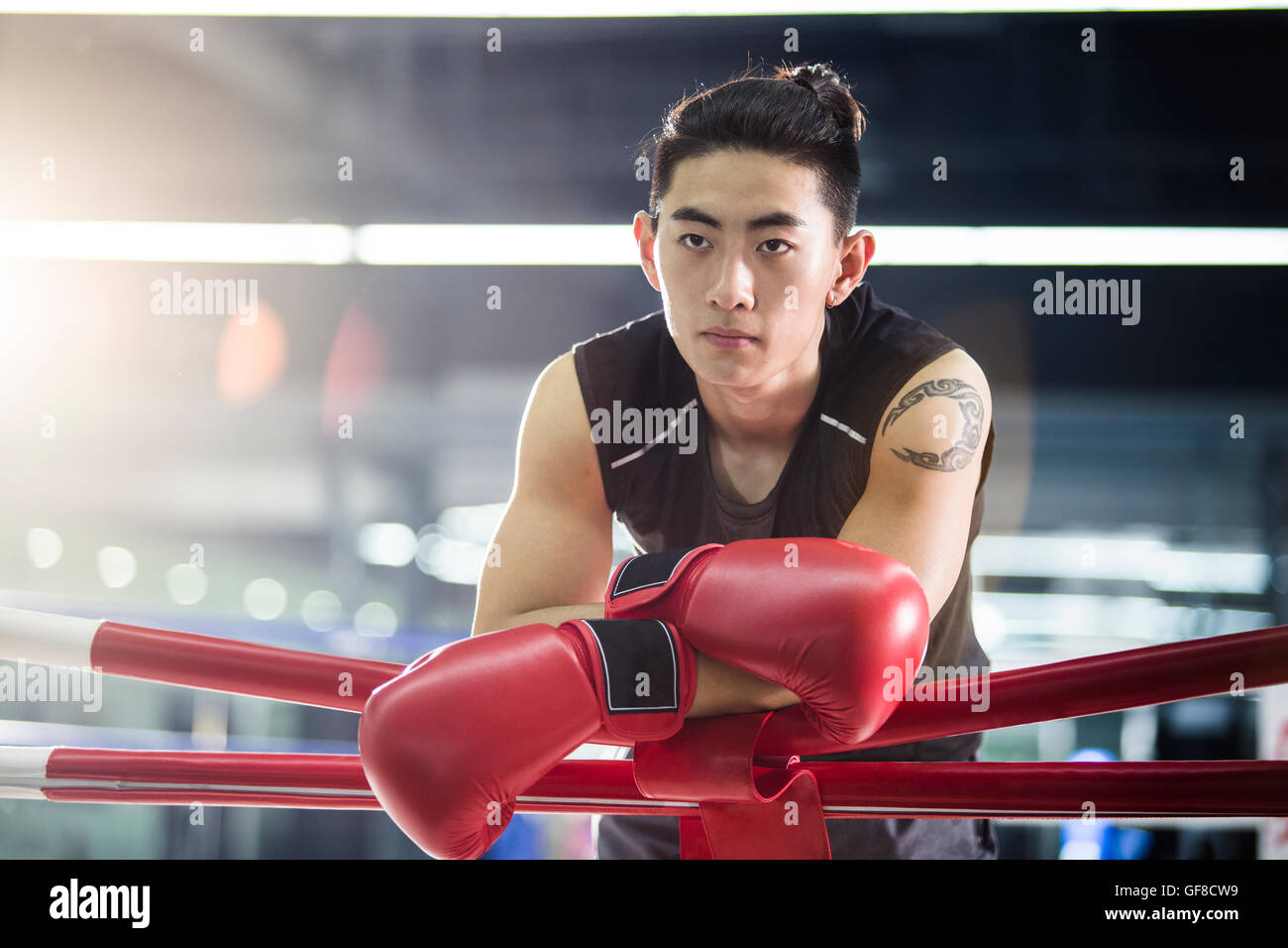 Chinese boxer resting in boxing ring Stock Photo - Alamy