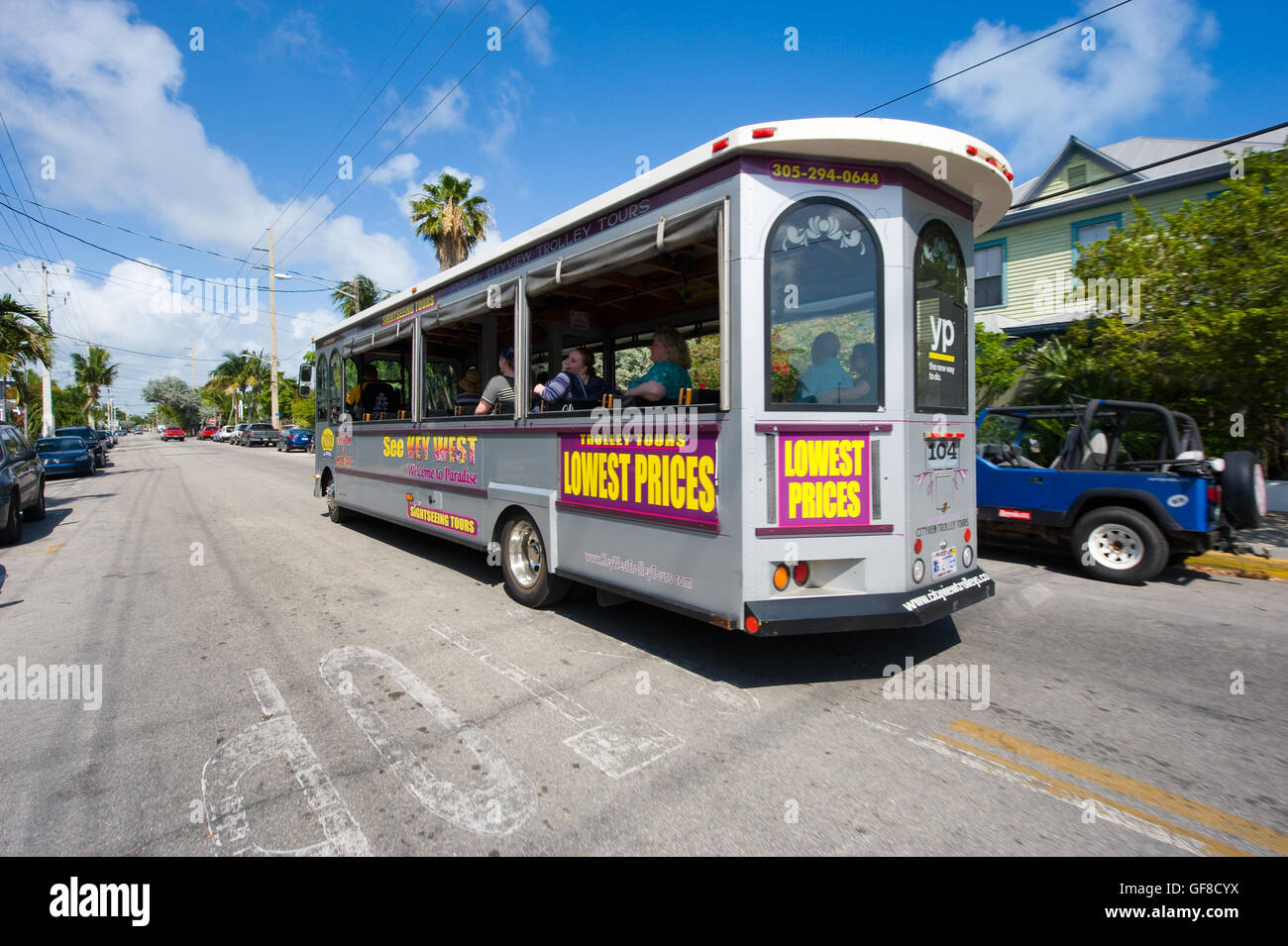 KEY WEST, FLORIDA, USA - MAY 02, 2016: Bus with tourists riding and ...