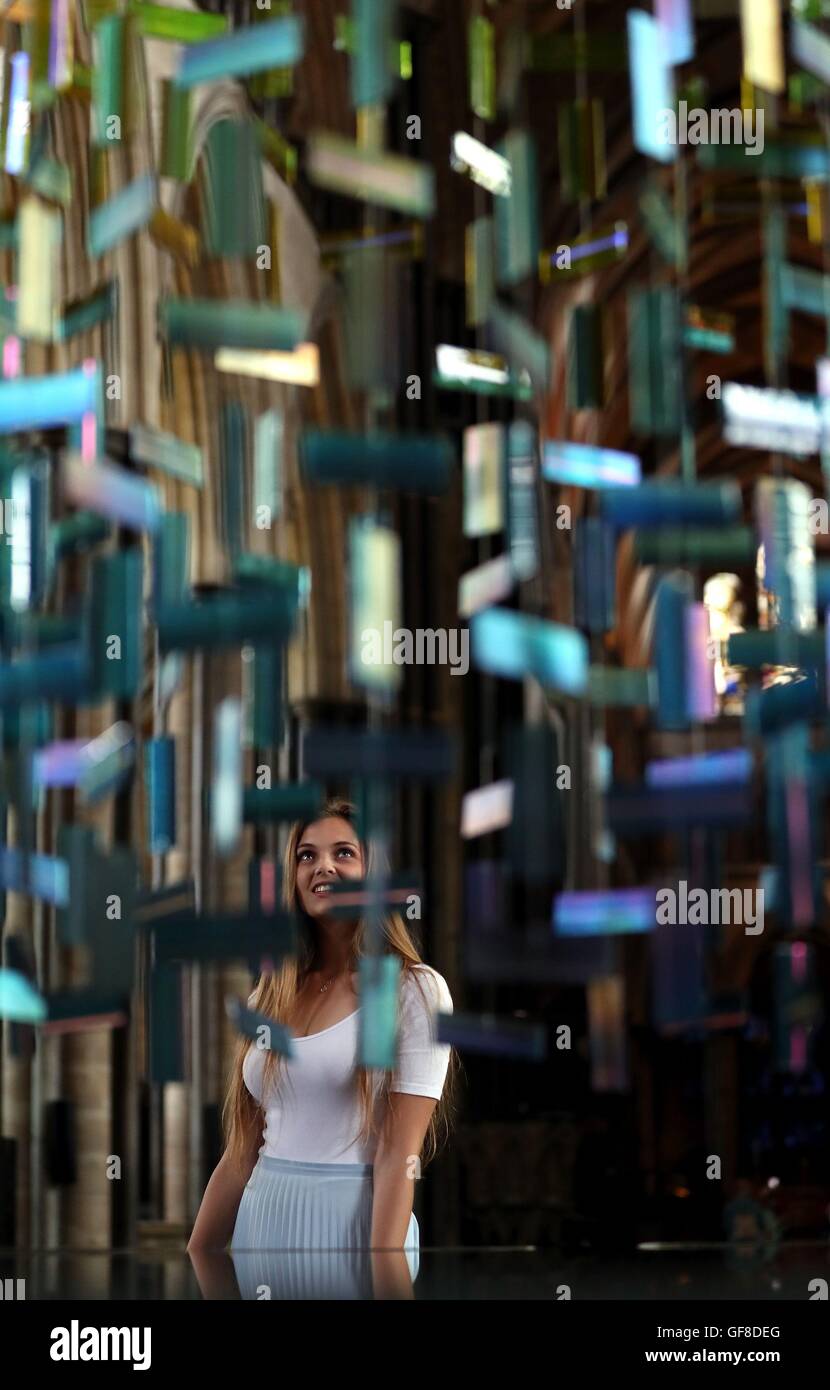 Salisbury Cathedral employee Lottie Pedder looks at the exhibit ...