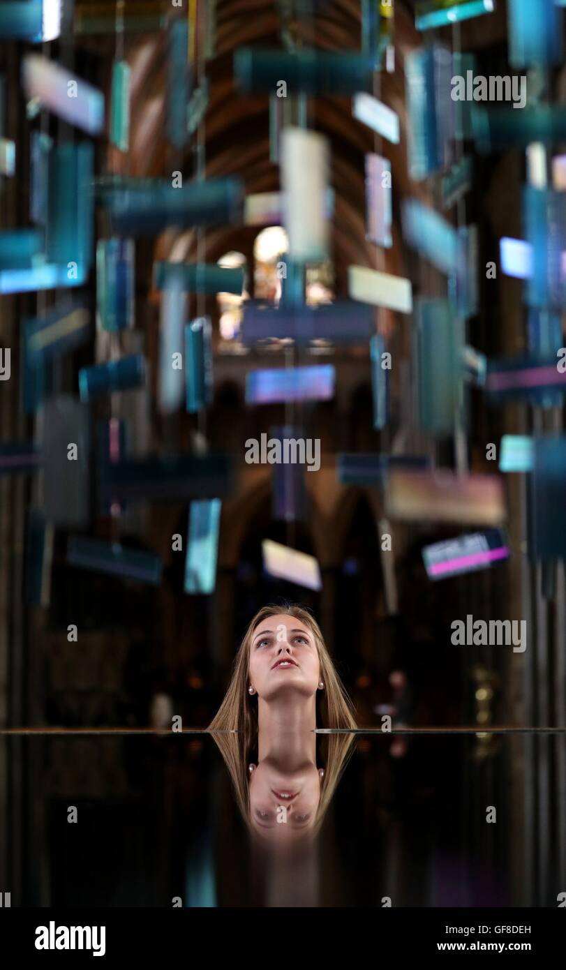 Salisbury Cathedral employee Lottie Pedder looks at the exhibit ...