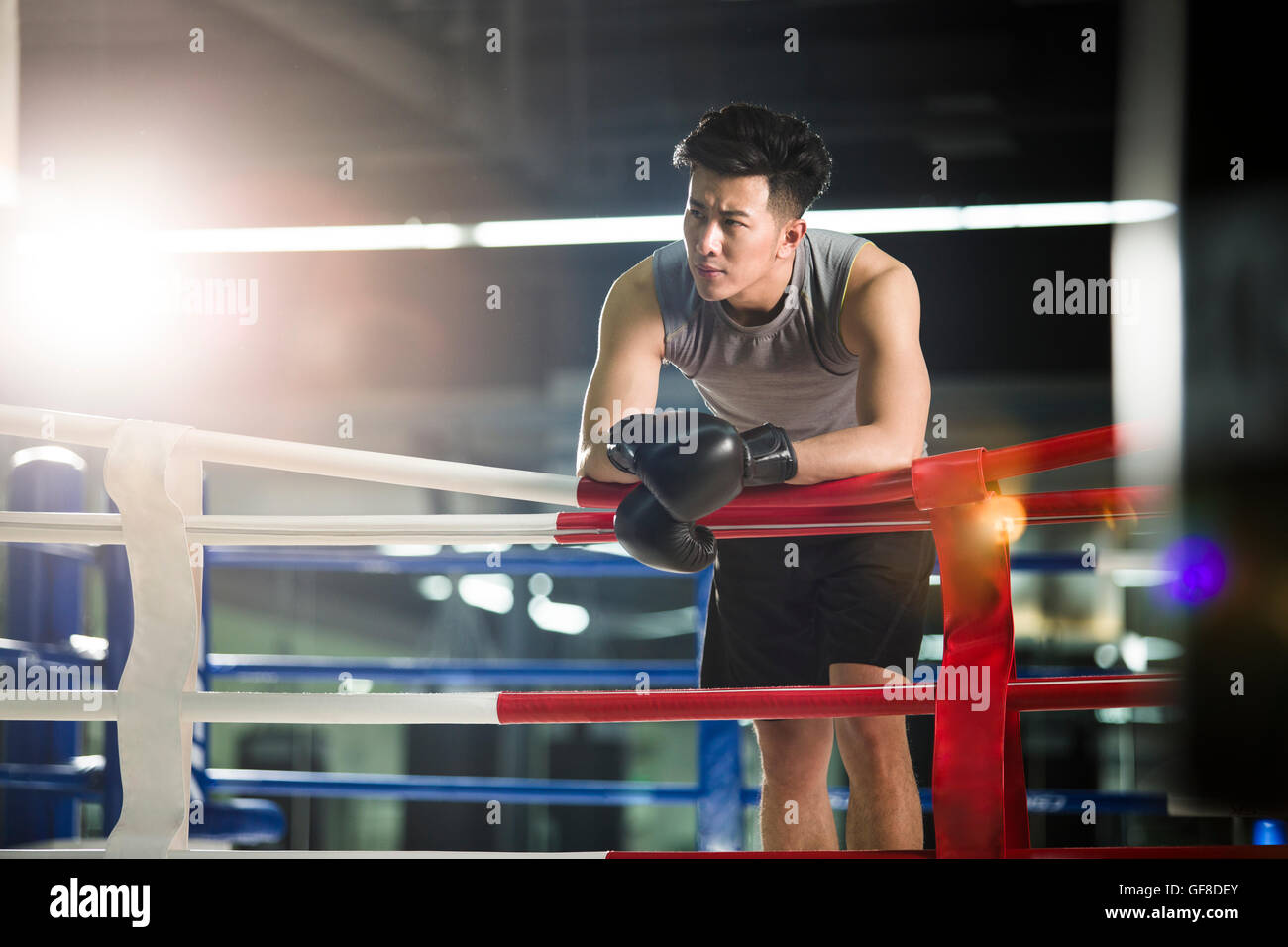 Chinese boxer resting in boxing ring Stock Photo - Alamy