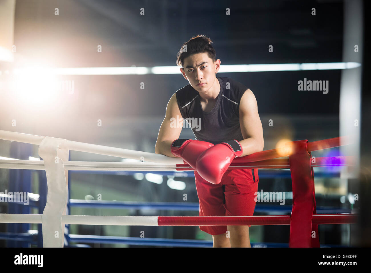 Chinese boxer resting in boxing ring Stock Photo - Alamy