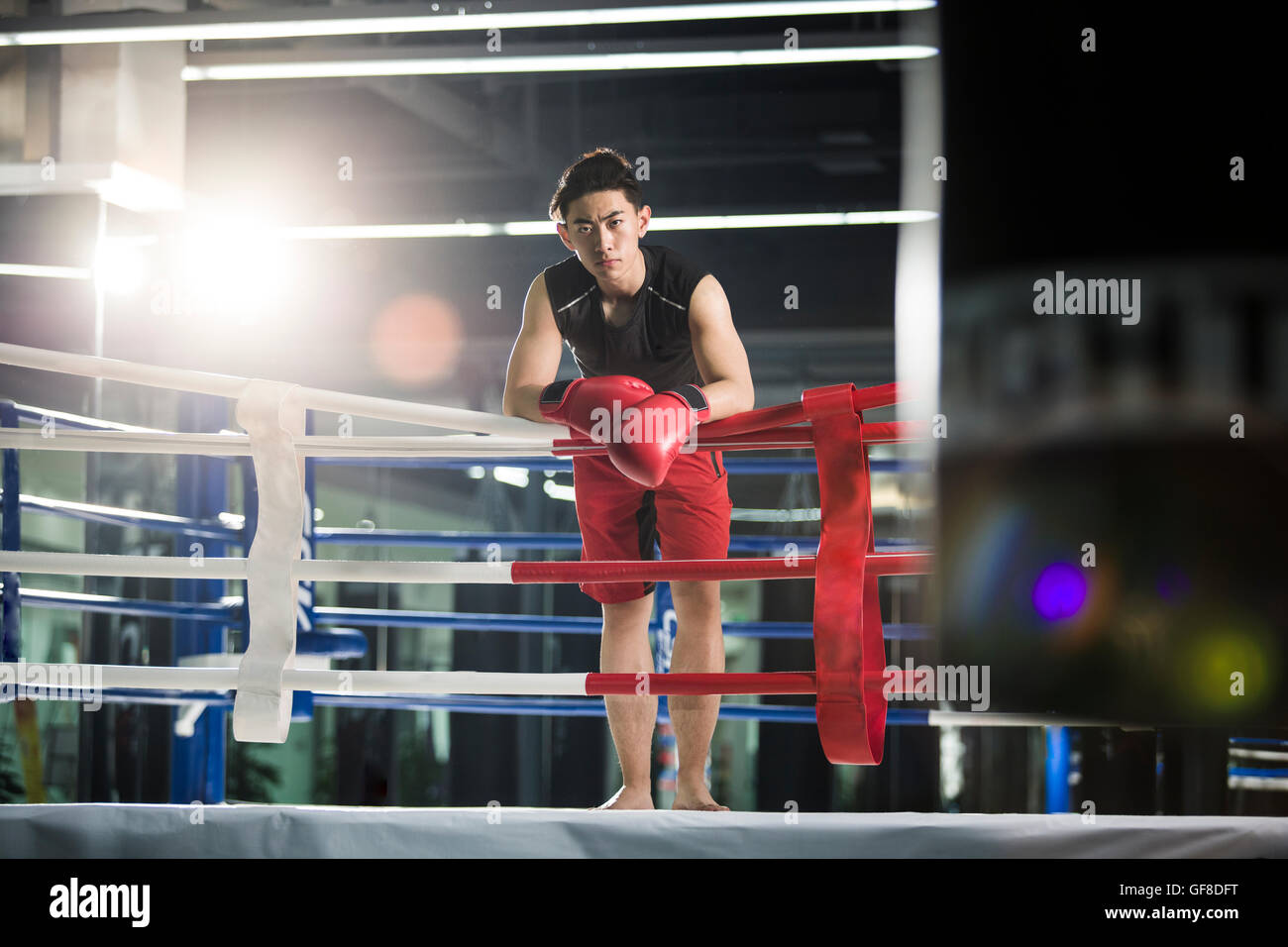 Chinese boxer resting in boxing ring Stock Photo - Alamy