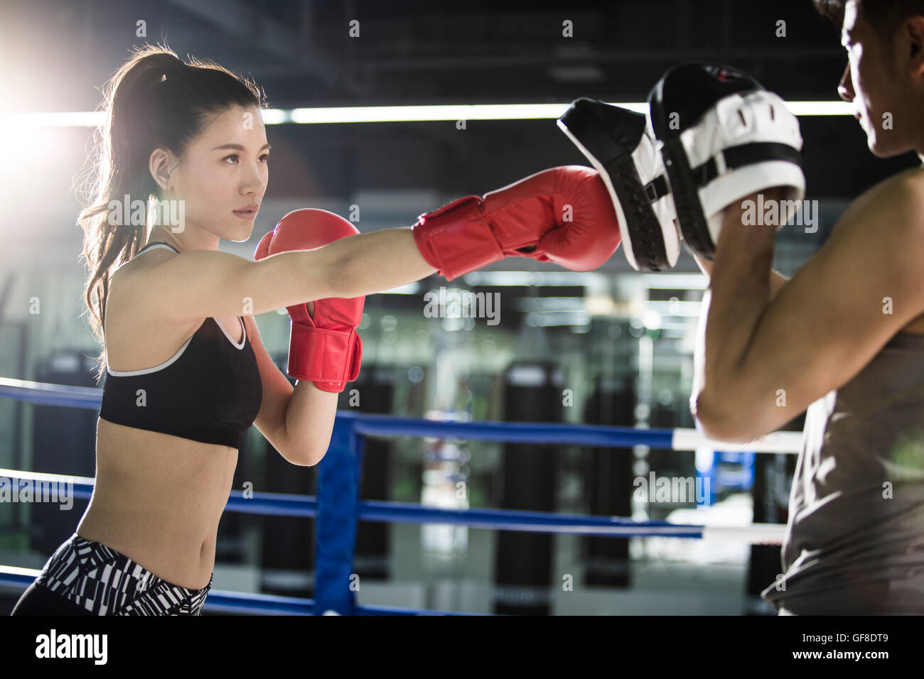 Female Chinese boxer training with coach Stock Photo - Alamy