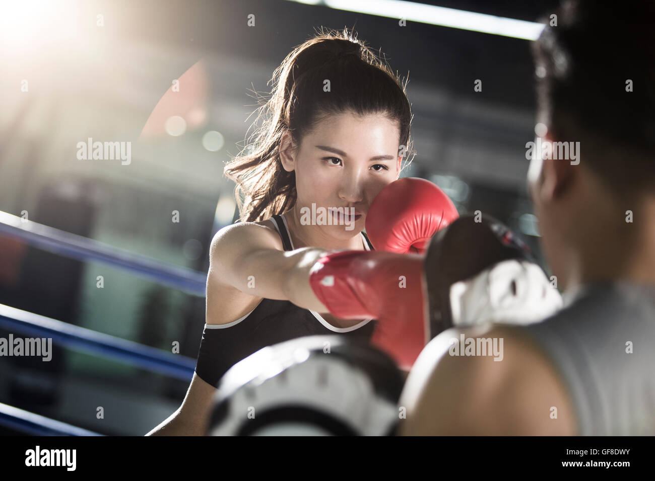 Female Chinese boxer training with coach Stock Photo - Alamy
