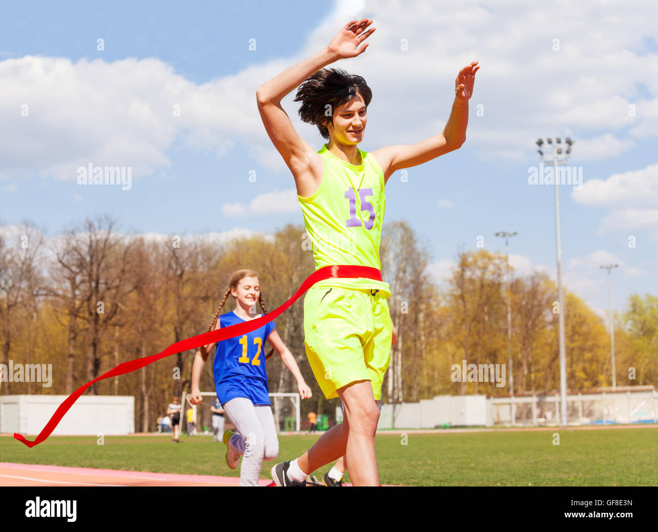 Sprinter crossing finish line hi-res stock photography and images - Alamy