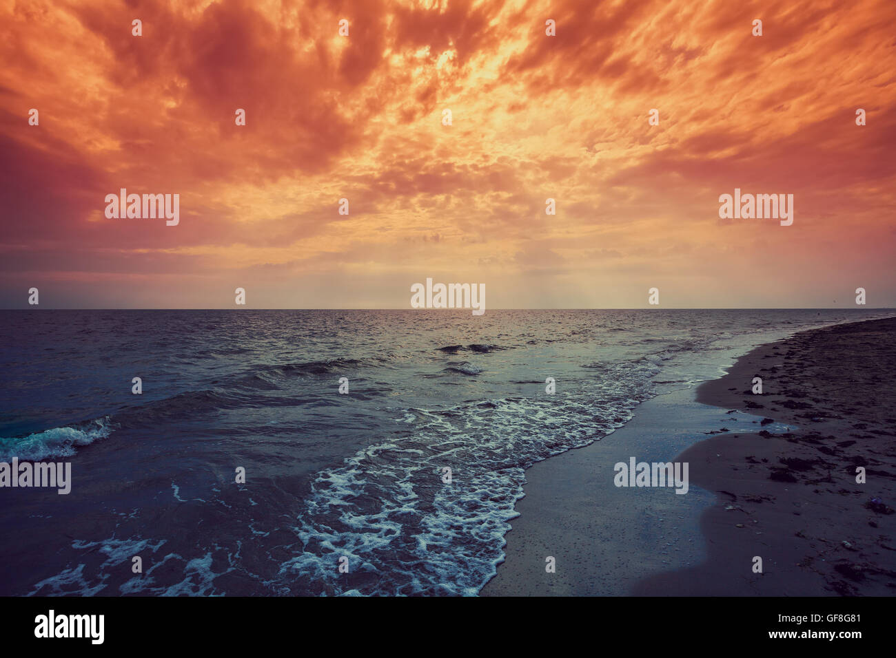 Dramatic sunset over sea Stock Photo - Alamy