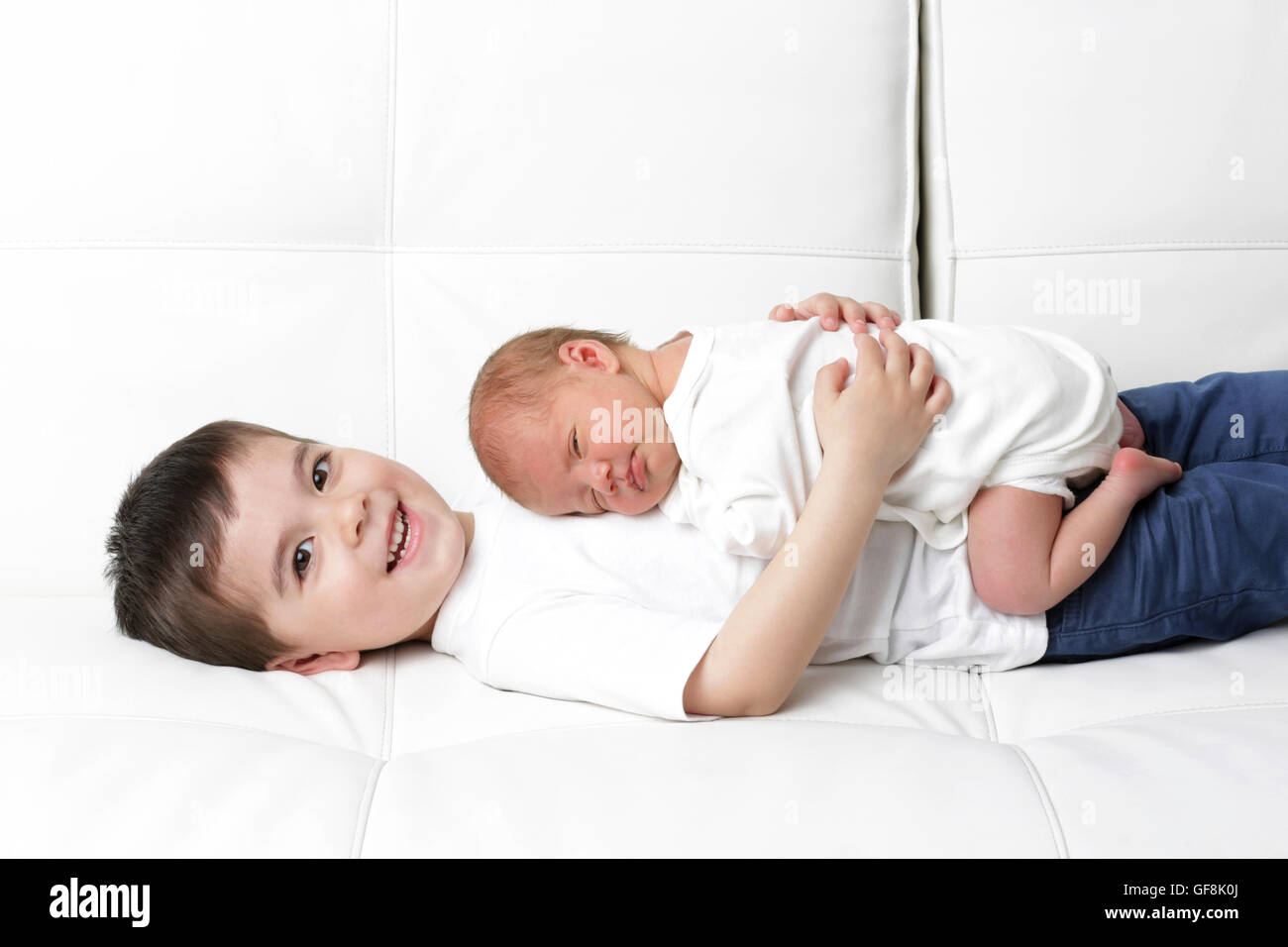 Newborn baby with brother Stock Photo - Alamy