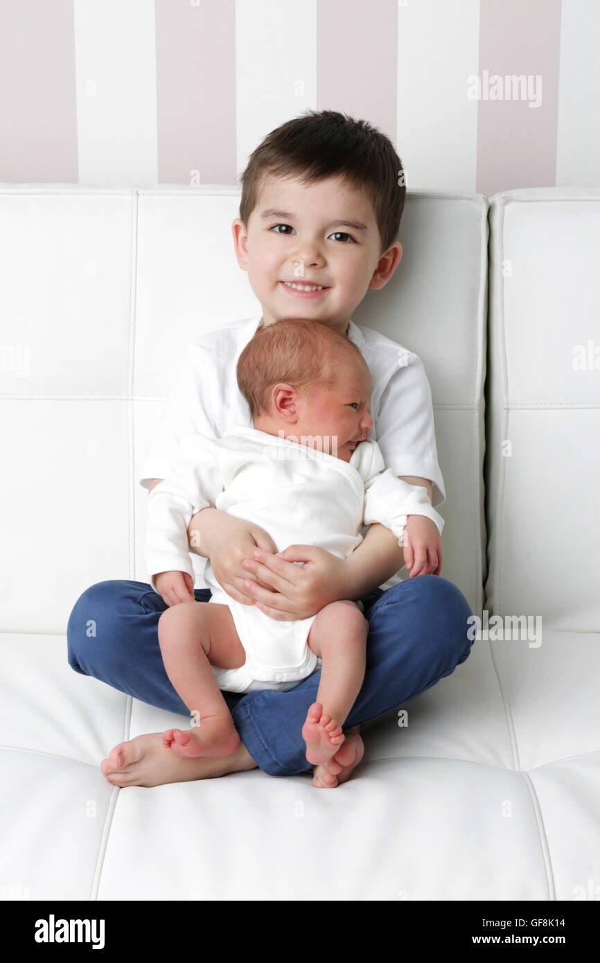 Newborn baby with brother Stock Photo - Alamy