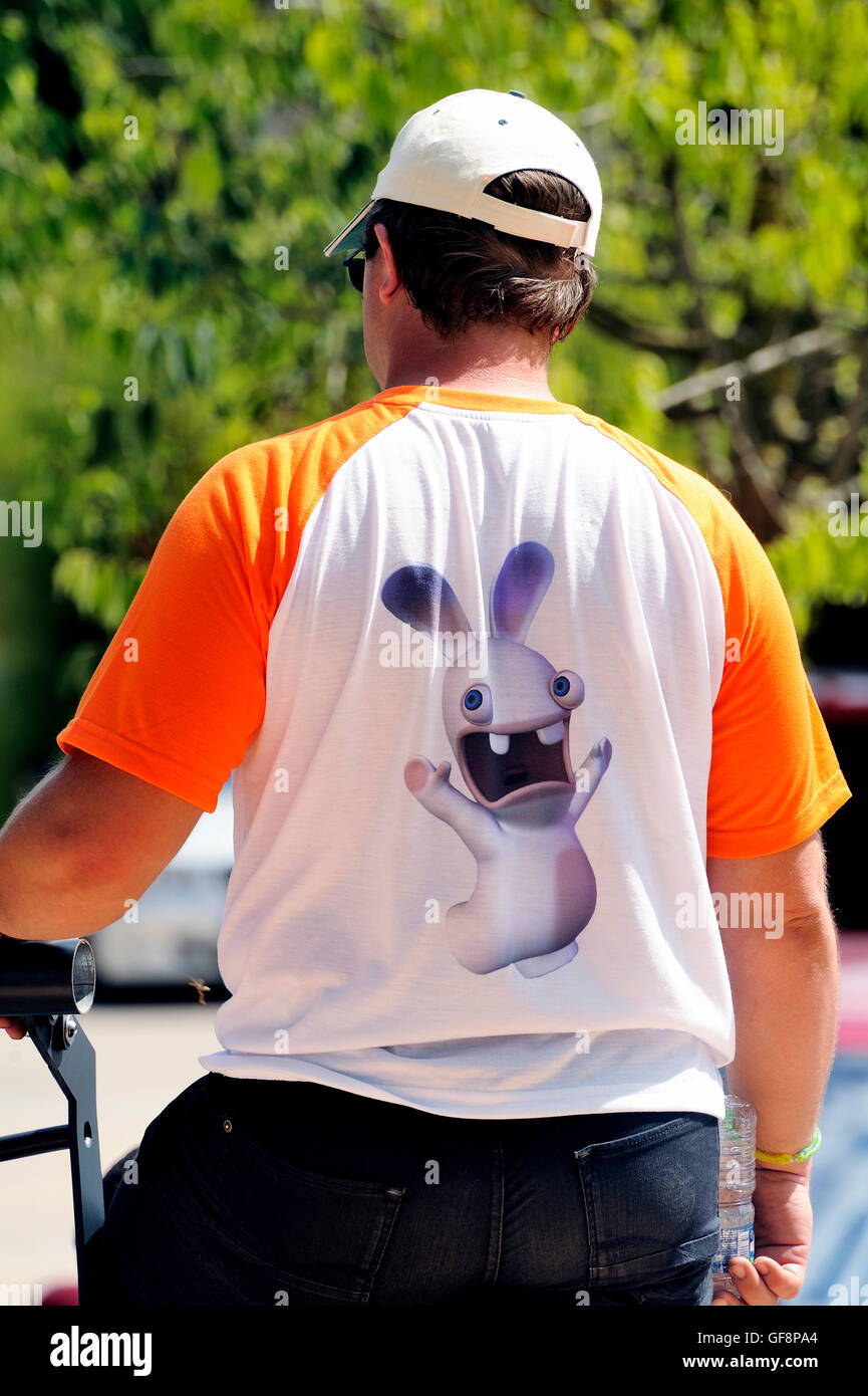 A man back with a T-shirt with an idiot rabbit in the back Stock Photo ...