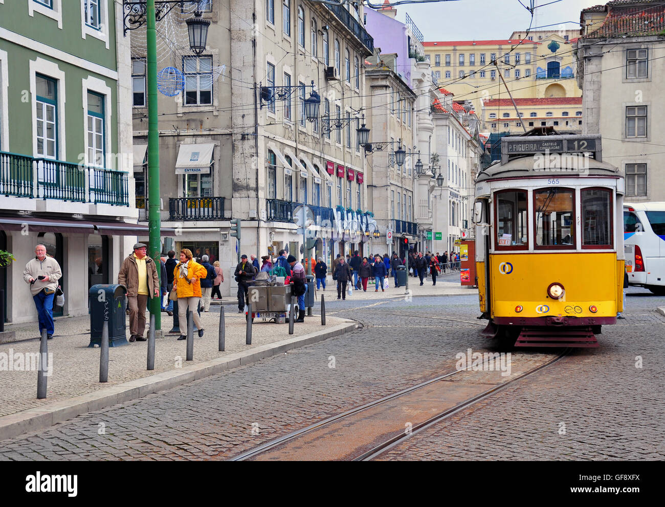 LISBON, PORTUGAL - NOVEMBER 23: Yellow tram number 12 goes by the ...