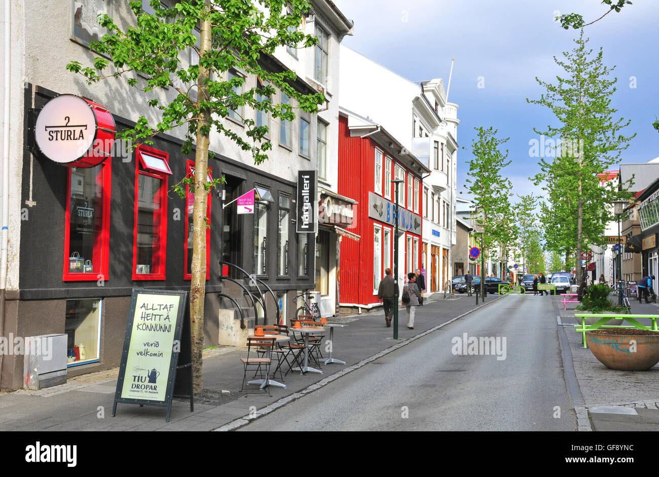 REYKJAVIK, ICELAND - JUNE 5: People goes down the street of Reykjavik ...