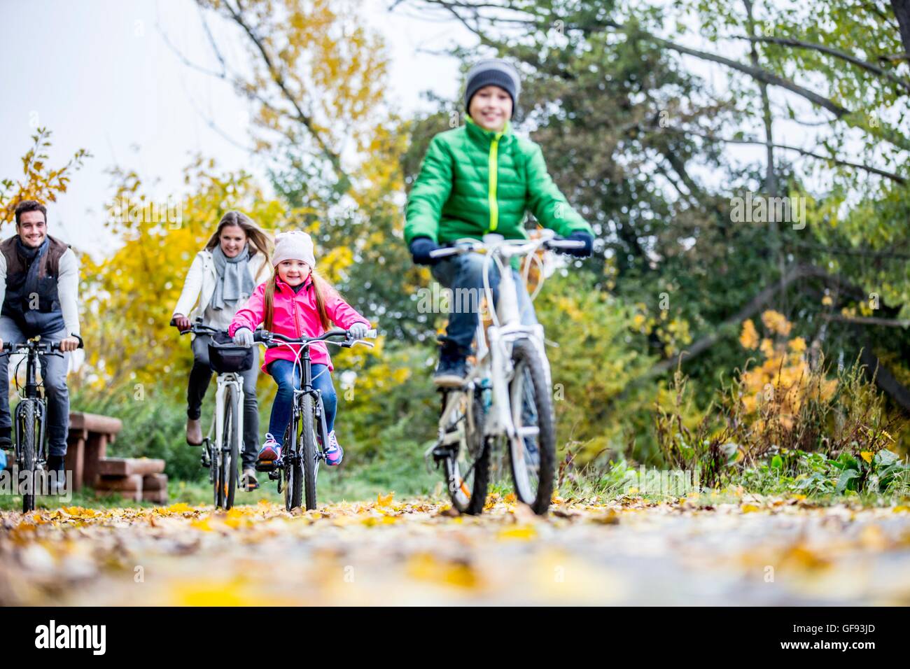 MODEL RELEASED. Family cycling together in autumn Stock Photo - Alamy