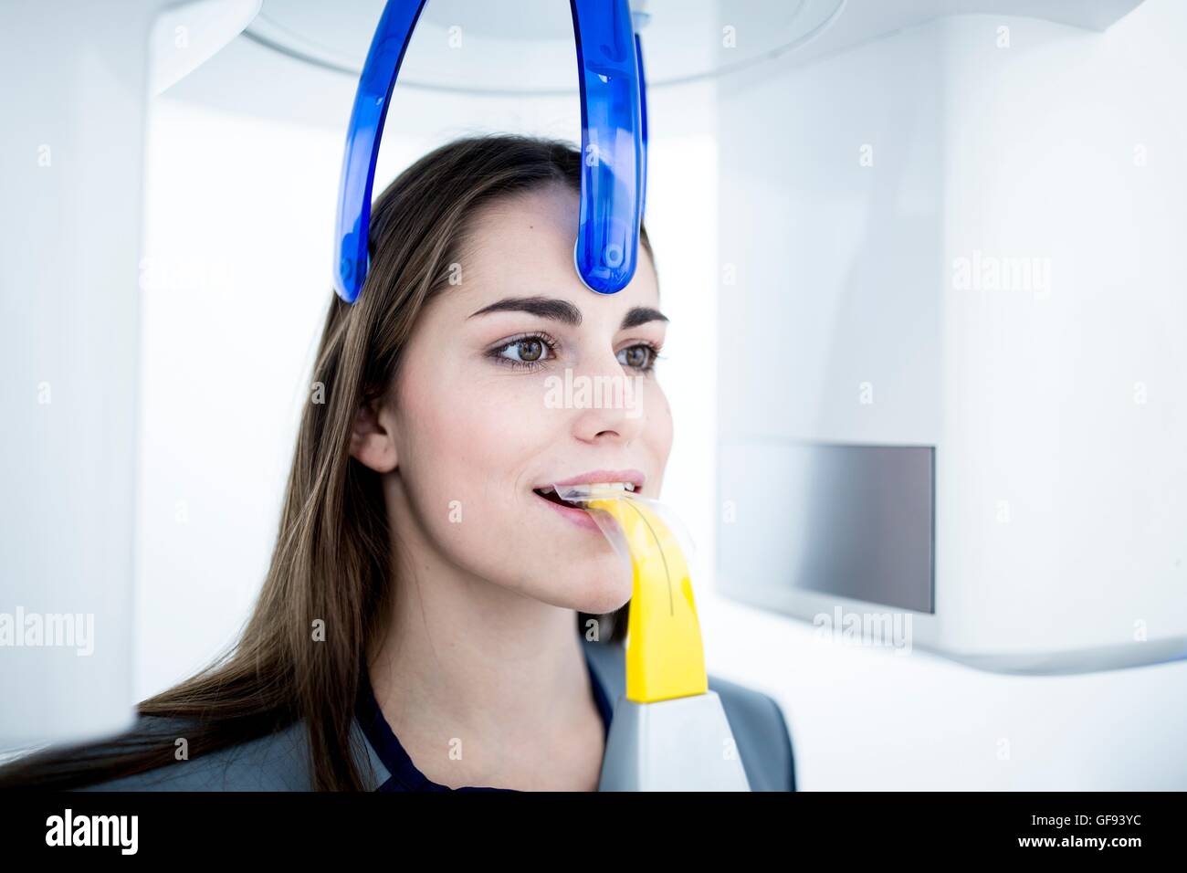 MODEL RELEASED. Young woman having x-ray in clinic Stock Photo - Alamy