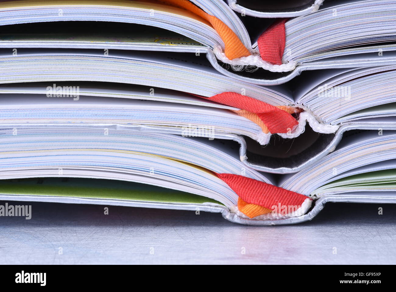 Closeup pile of open books Stock Photo - Alamy