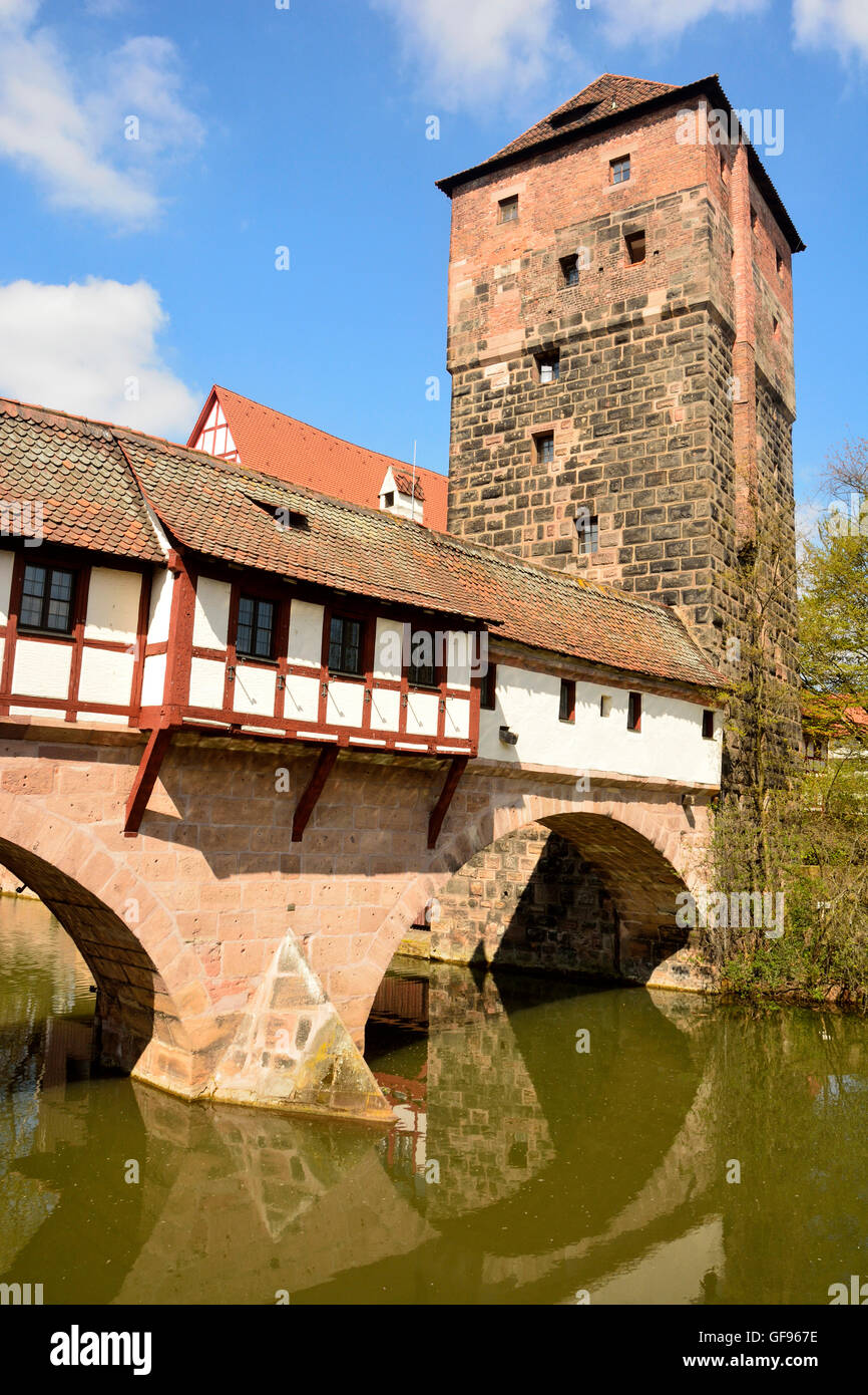 Covered Henkersteg bridge with adjacent tower in Nuremberg Stock Photo ...