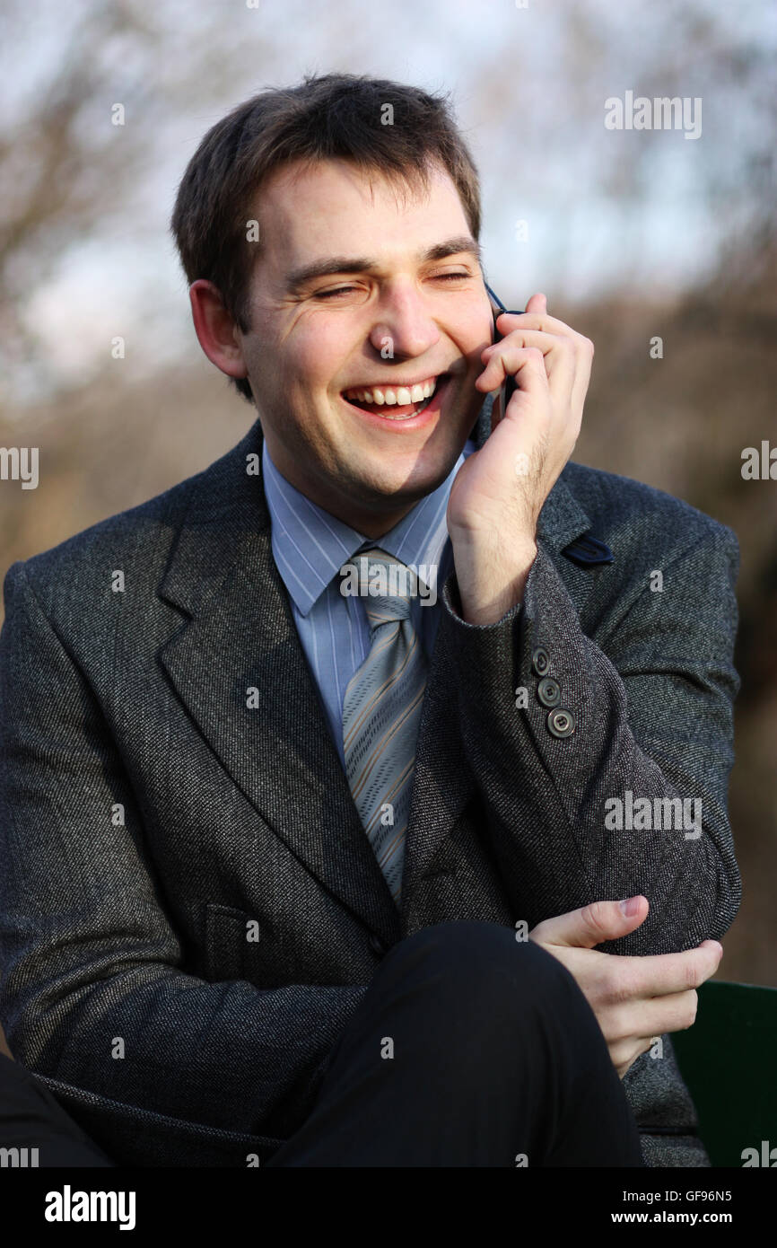 Portrait of young attractive man calling by phone Stock Photo - Alamy