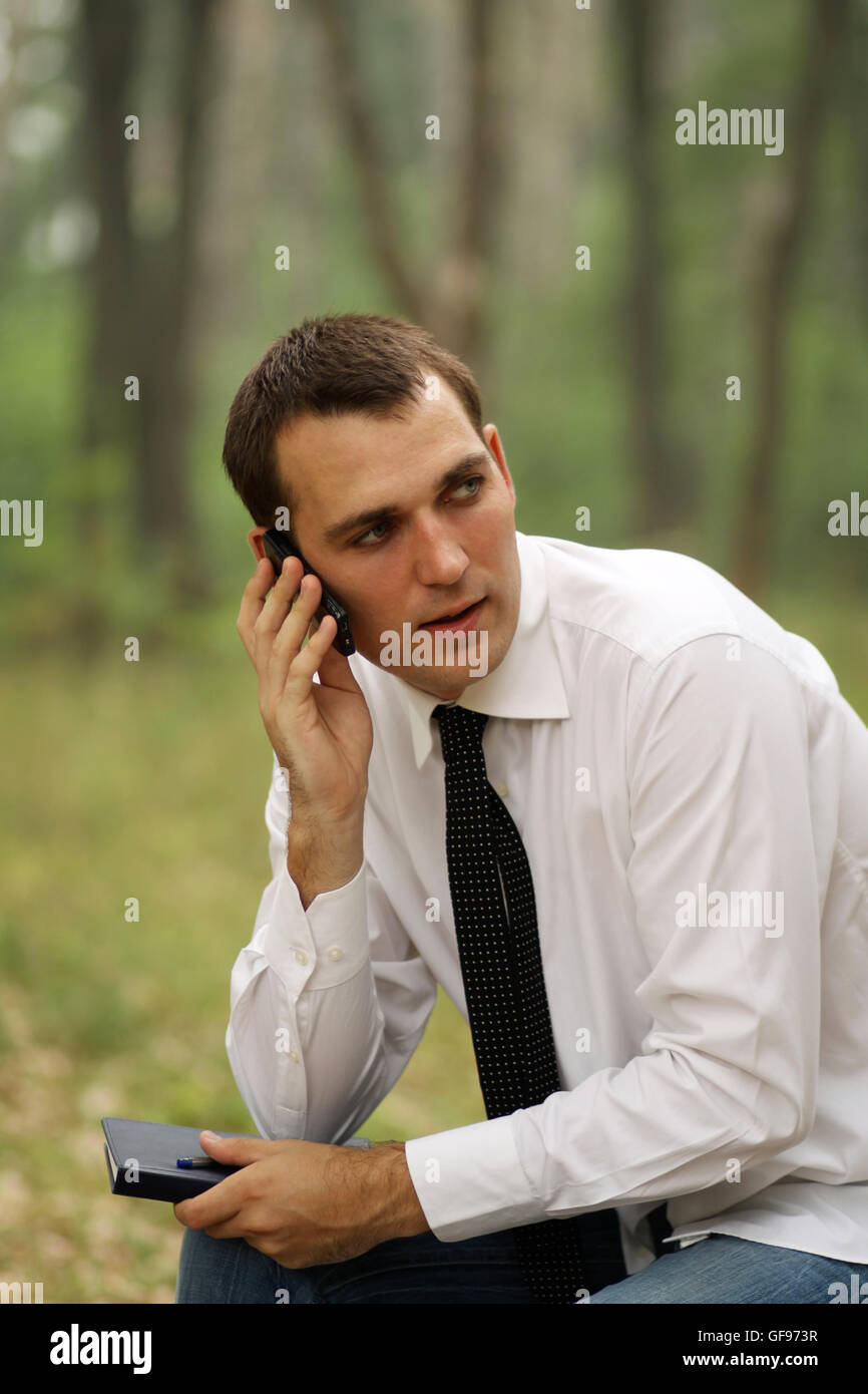 Portrait of young attractive man calling by phone Stock Photo - Alamy