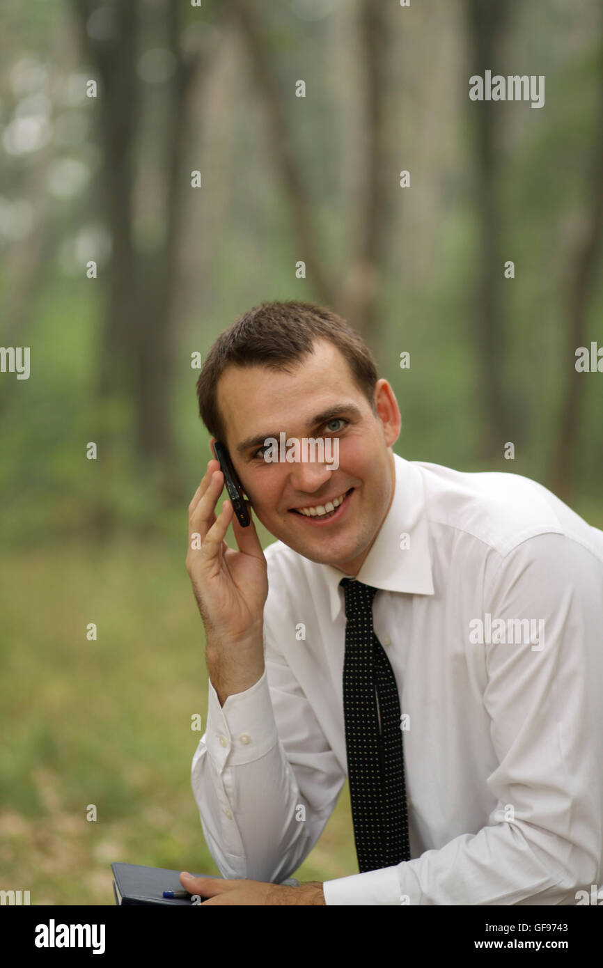 Portrait of young attractive man calling by phone Stock Photo - Alamy