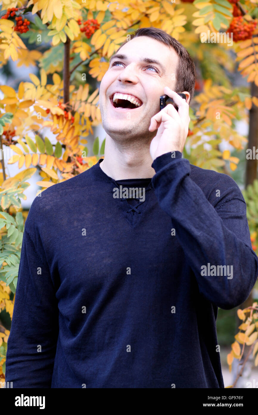 Portrait of young attractive man calling by phone Stock Photo - Alamy
