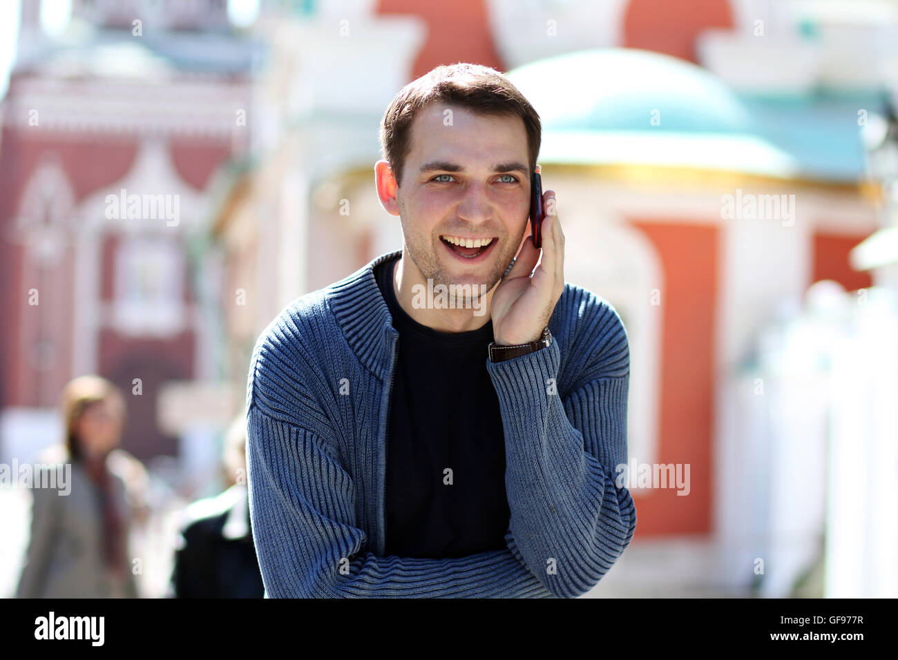 happy men calling by phone Stock Photo - Alamy