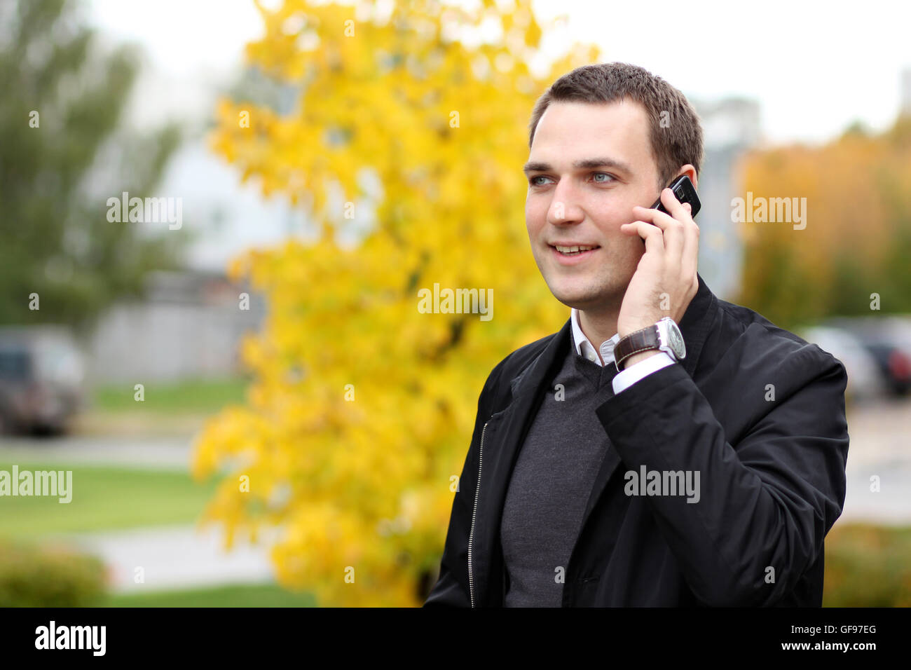 Portrait of young attractive man calling by phone Stock Photo - Alamy