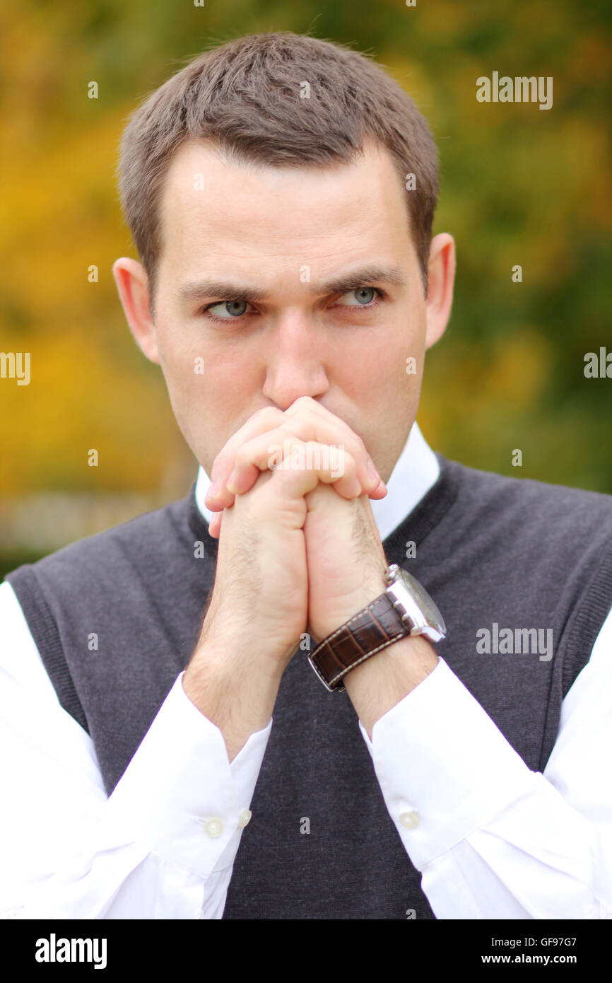 Portrait of young attractive gloomy man Stock Photo - Alamy