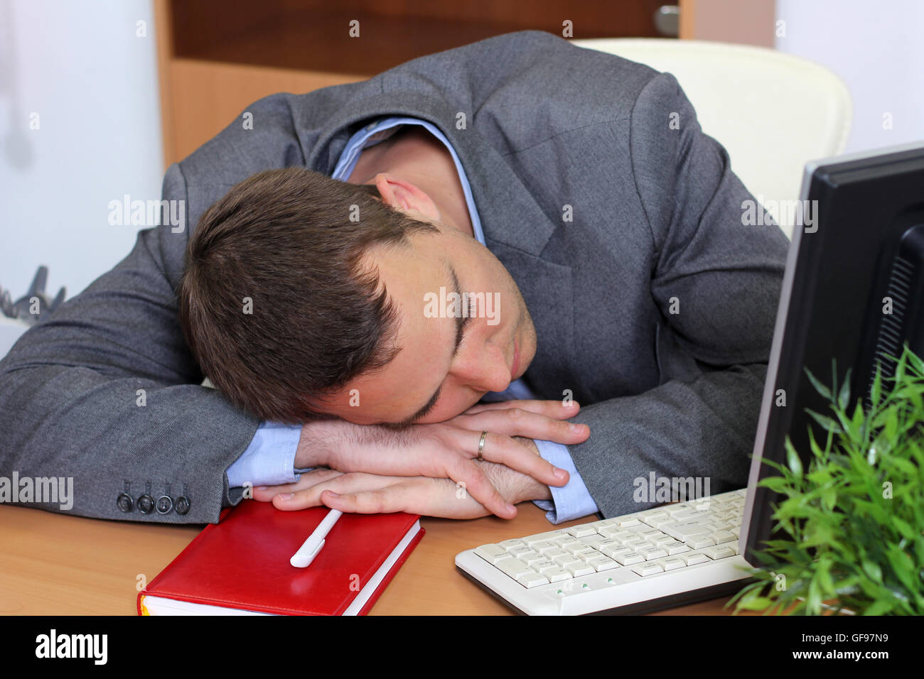 office worker, a man sleeping on the job Stock Photo - Alamy