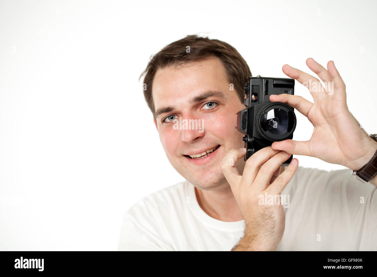 Happy young men using a camera to take photo, isolated on white Stock ...