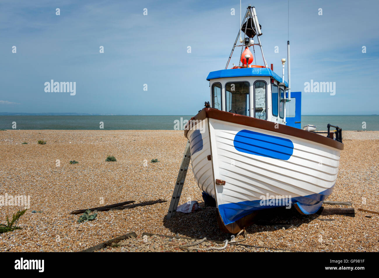 Small, well preserved boat on a beach Stock Photo - Alamy